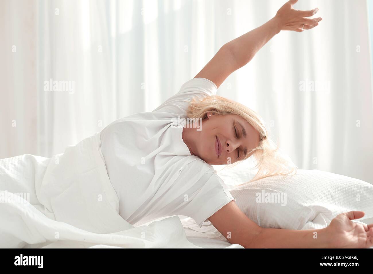 beautiful young woman waking up early in the morning Stock Photo - Alamy