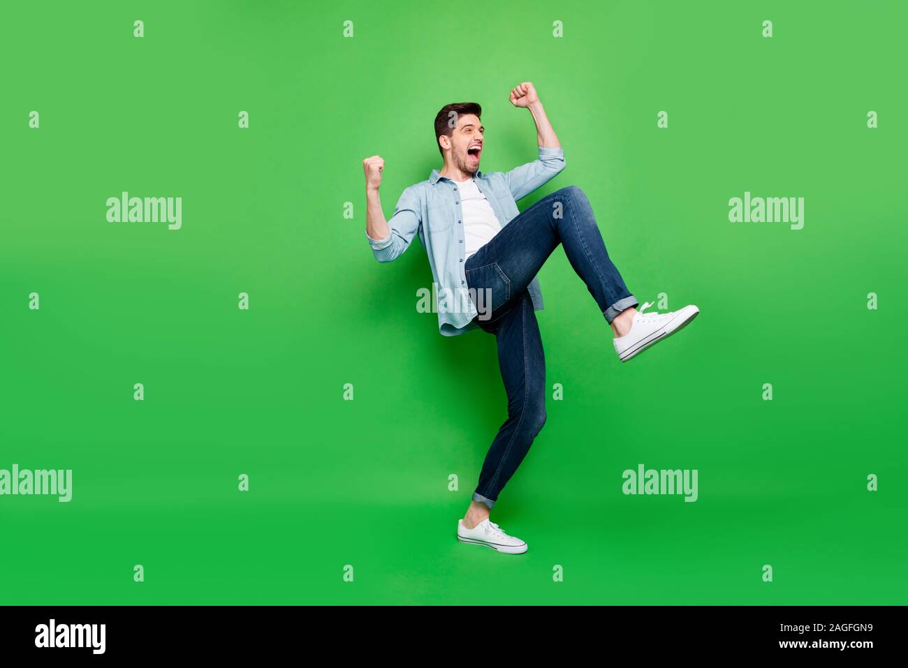 Full length body size turned photo of cheerful positive excited ...