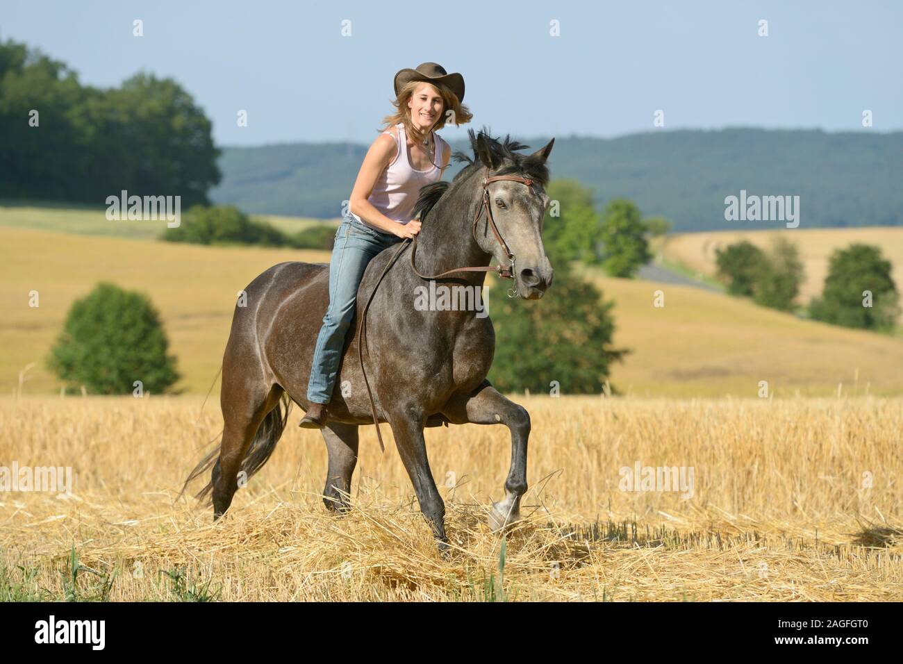 Pony horse riding gallop western hi-res stock photography and images ...