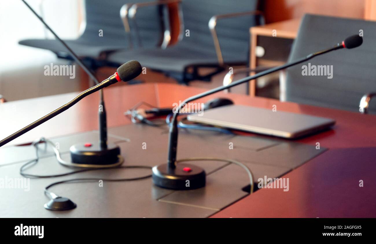 microphone on a wooden table of a boardroom. Business concept Stock ...