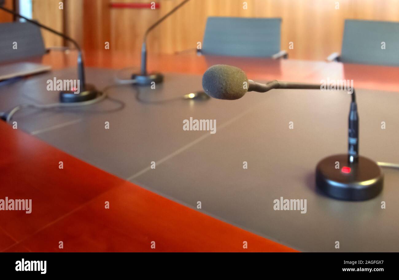 microphone on a wooden table of a boardroom. Business concept Stock ...