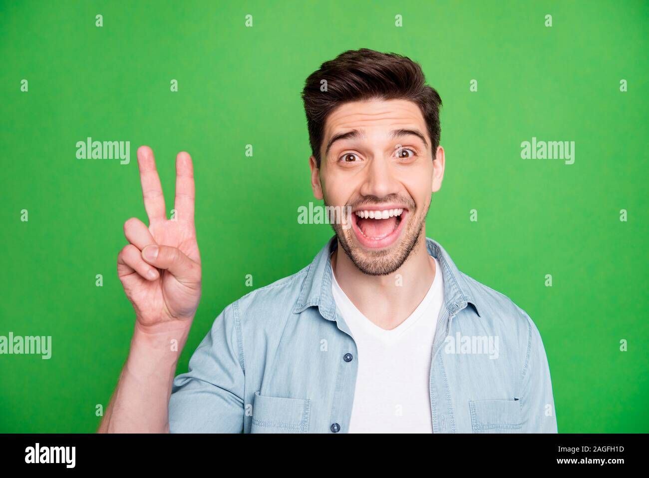 Portrait of cheerful crazy excited overjoyed man having noticed his old ...