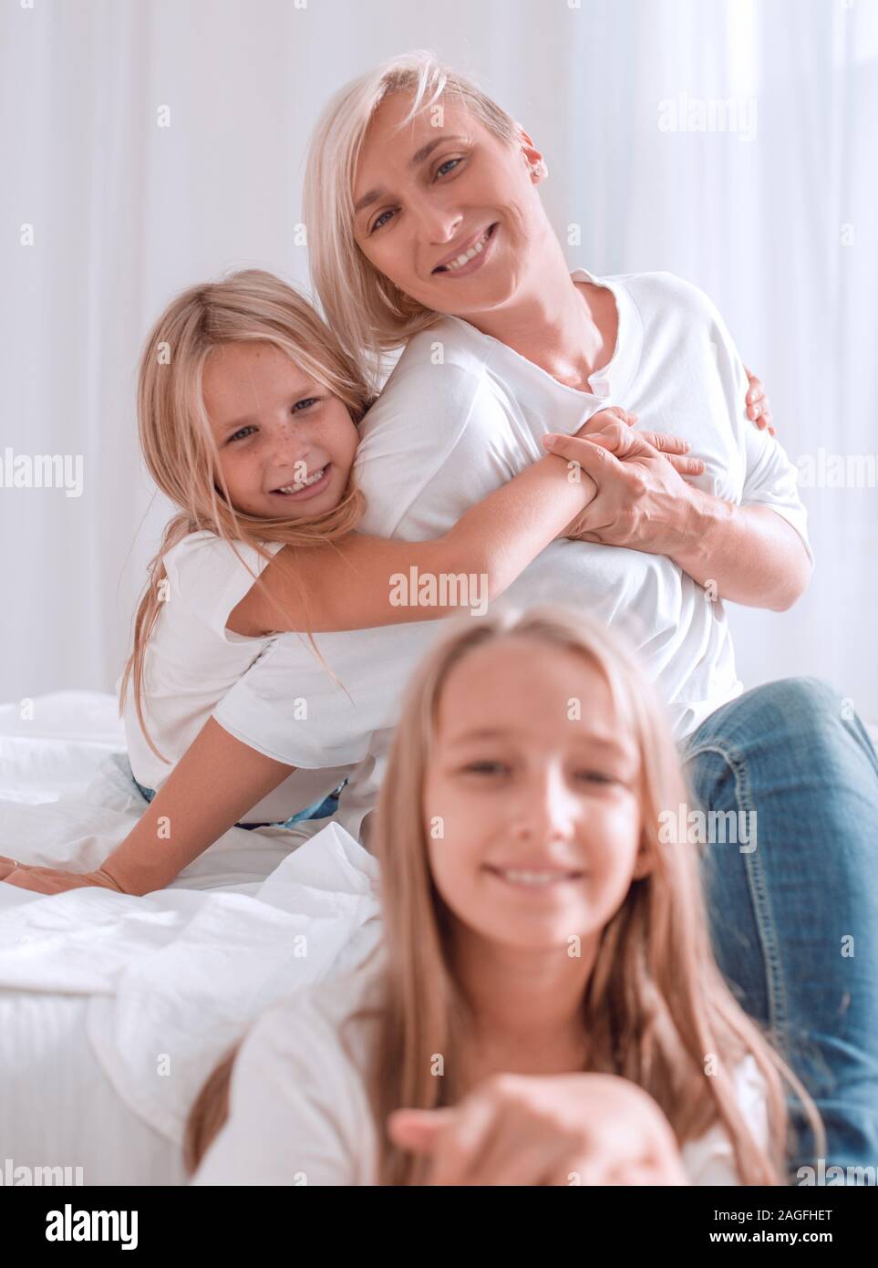 portrait of a mother with two small daughters Stock Photo - Alamy