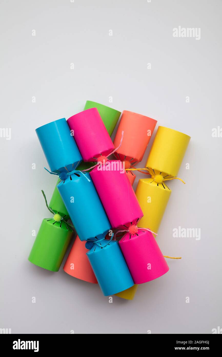 Bright colourful hristmas crackers on a plain background. festive ...
