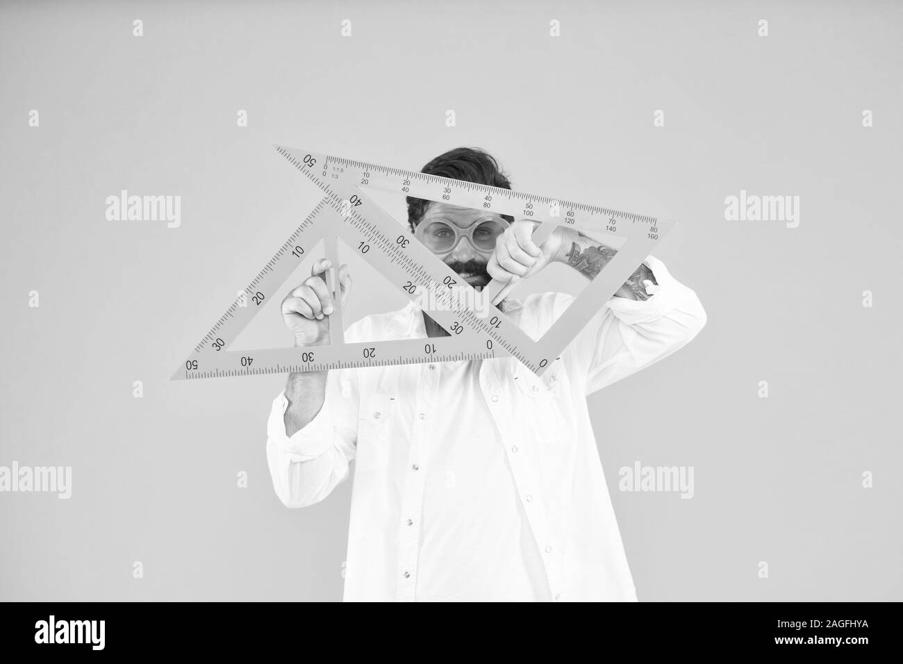 College university education. Bearded nerd with triangle. Exploring ...