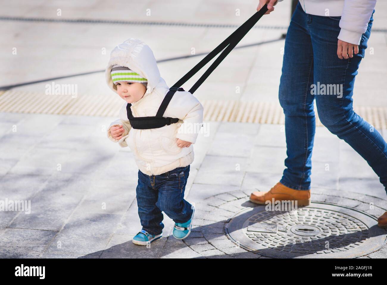 Mothers teach to walk on the road Stock Photo - Alamy