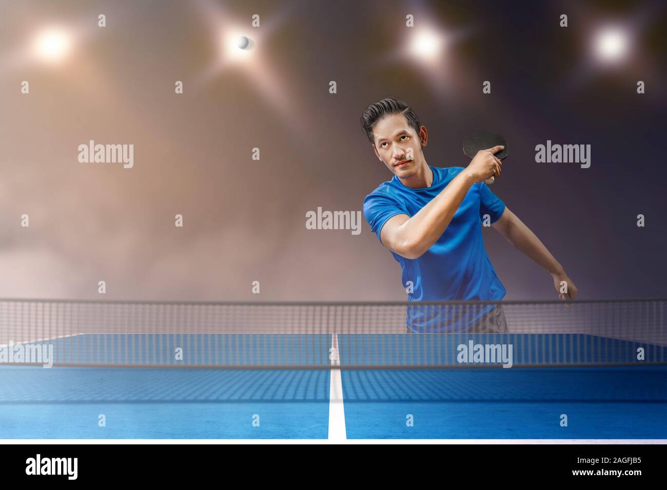 Asian table tennis player man swing the tennis table racket with ...