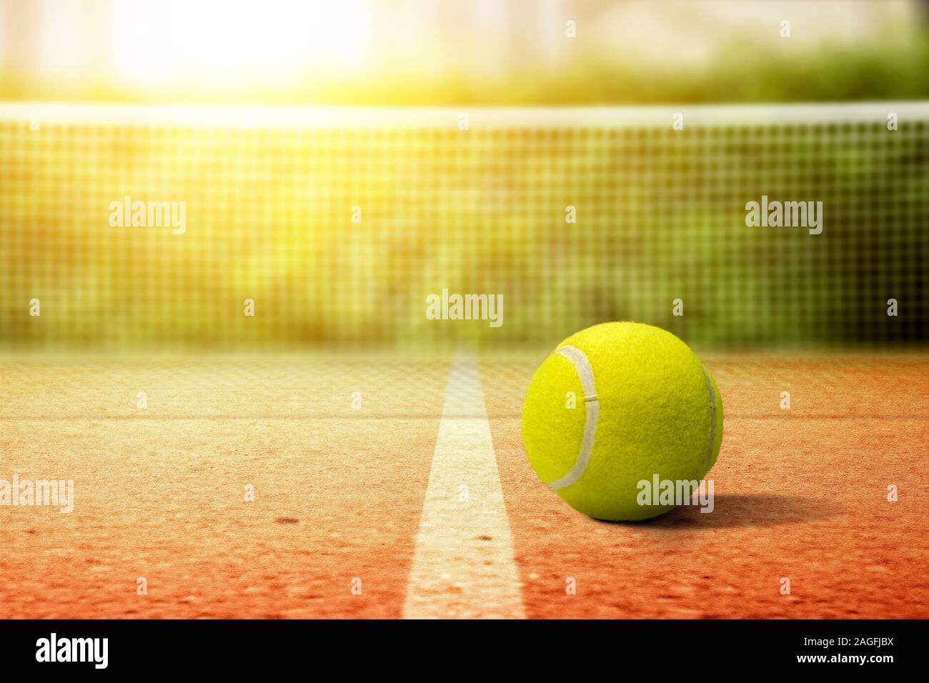 Closeup view of a tennis ball on the tennis court with sunlight ...