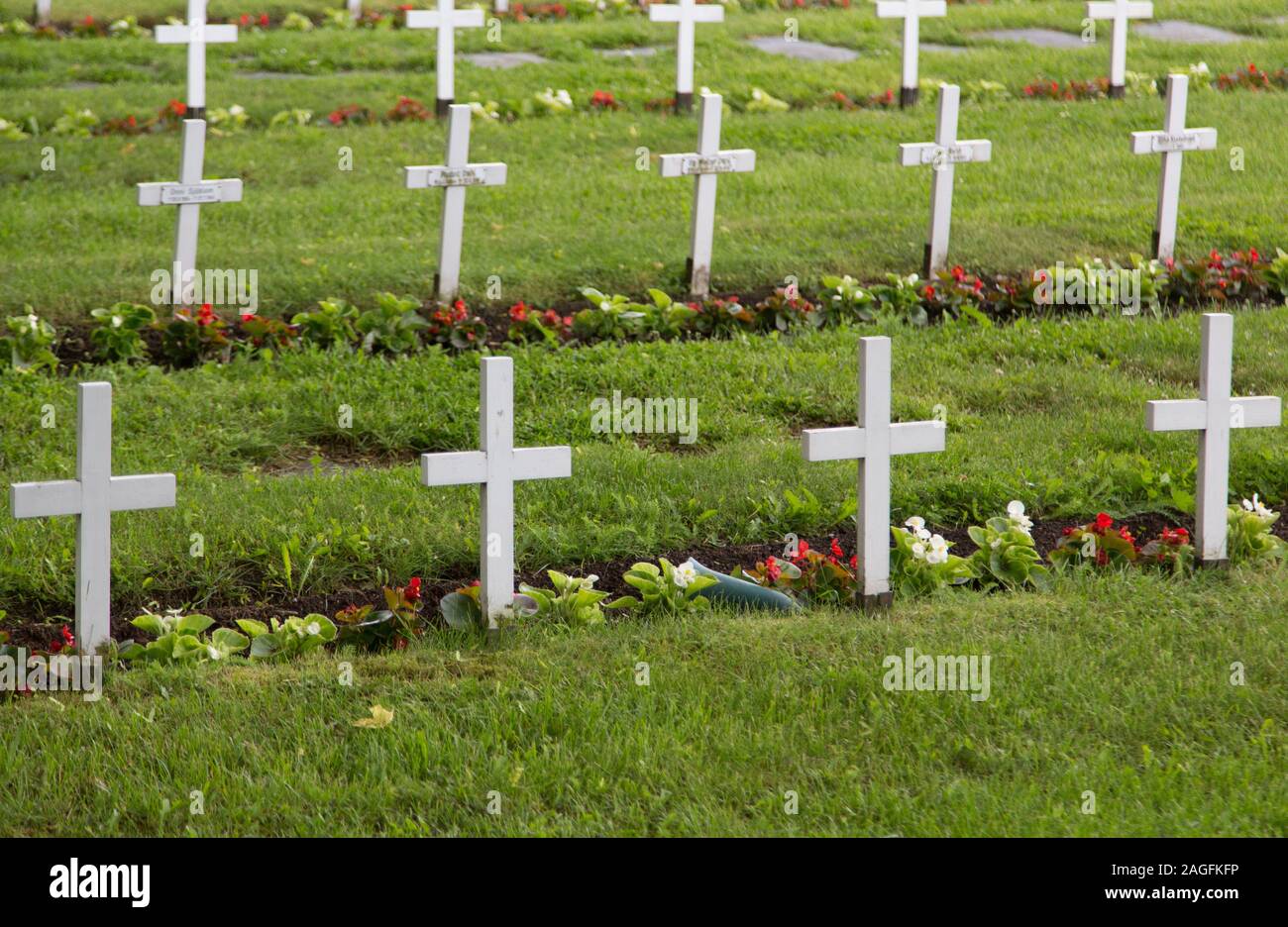 Graveyard or a cemetary with graves showing Stock Photo - Alamy