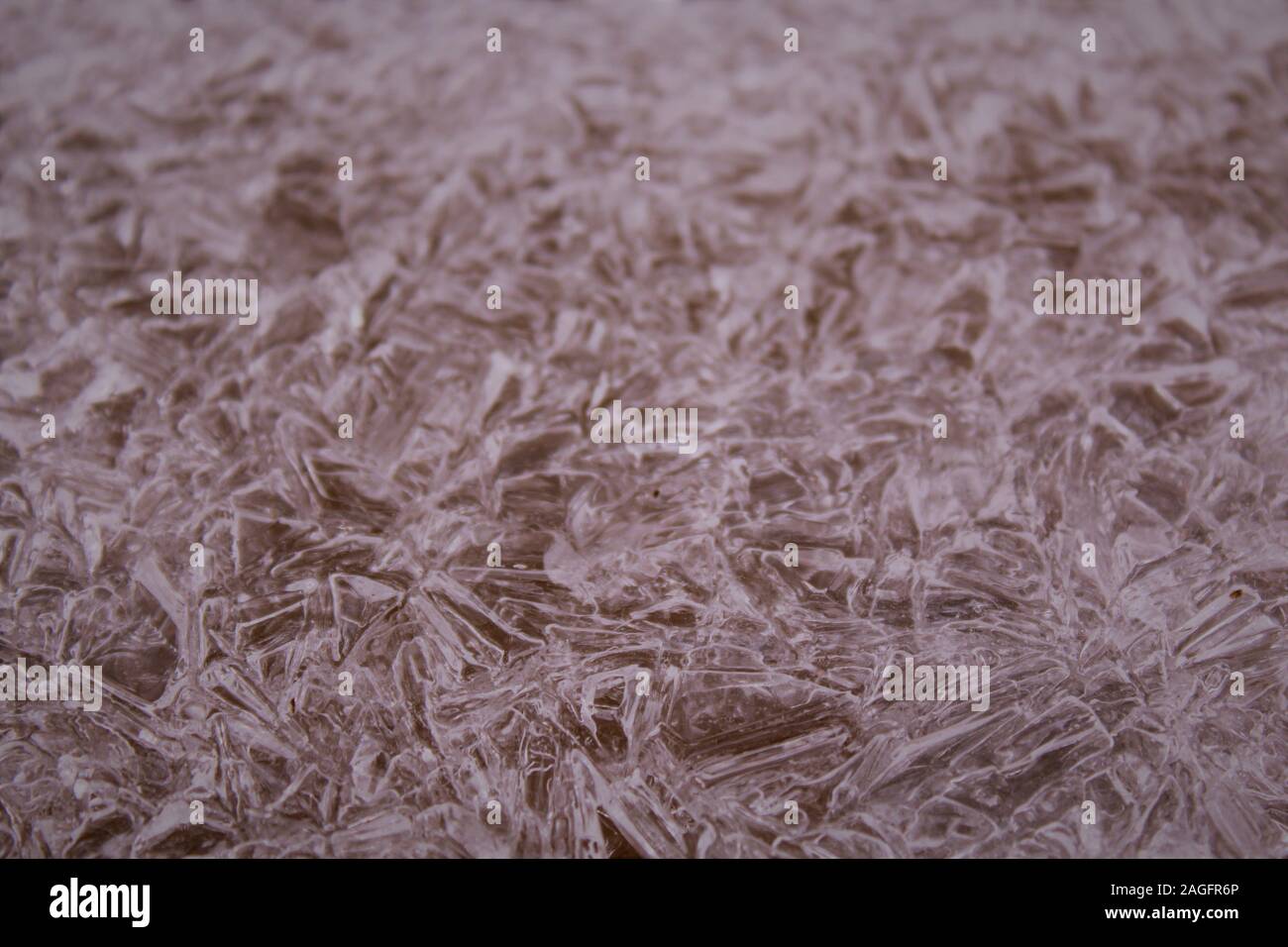 The picture shows frozen ice on a puddle Stock Photo - Alamy