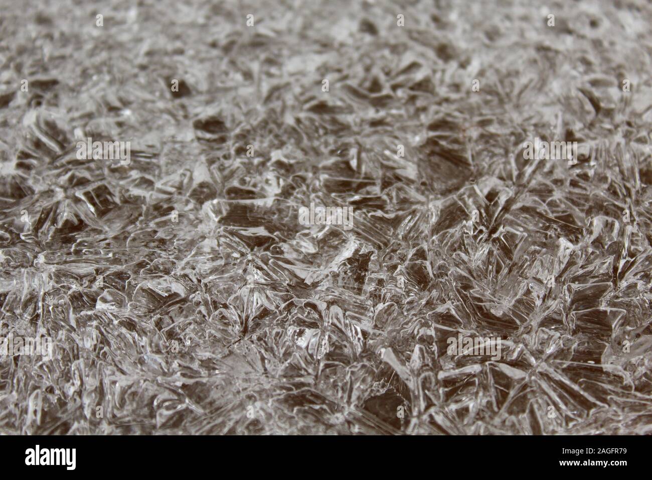 The picture shows frozen ice on a puddle Stock Photo - Alamy
