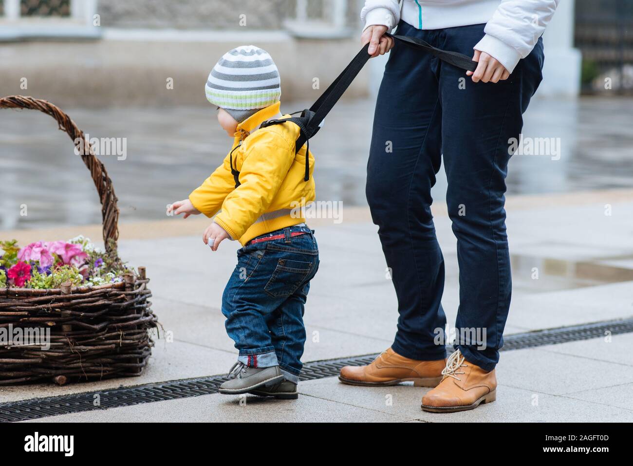 Mothers teach to walk on the road Stock Photo - Alamy