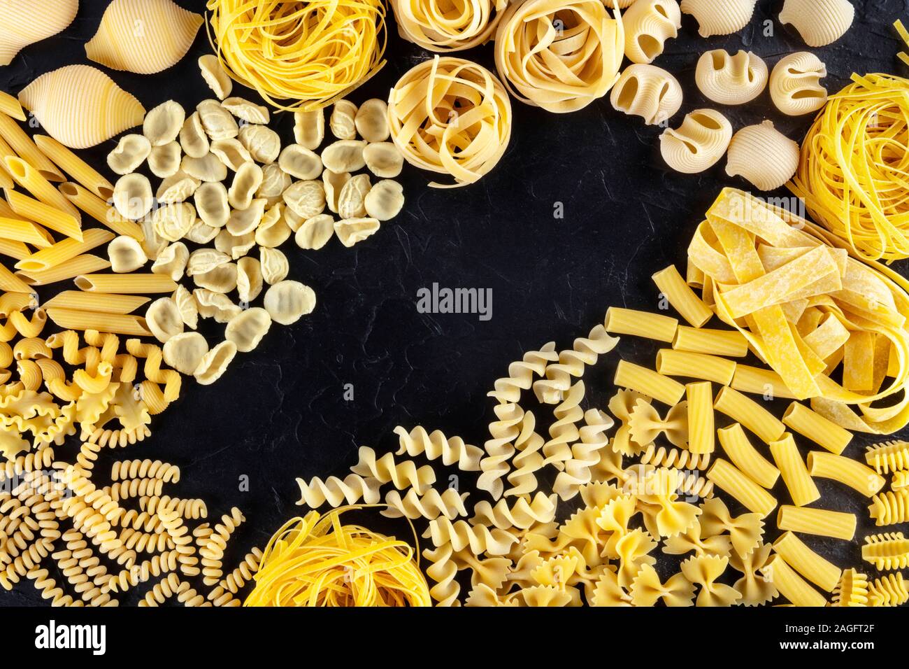 Italian pasta design with copy space, a flat lay of a variety of pasta ...