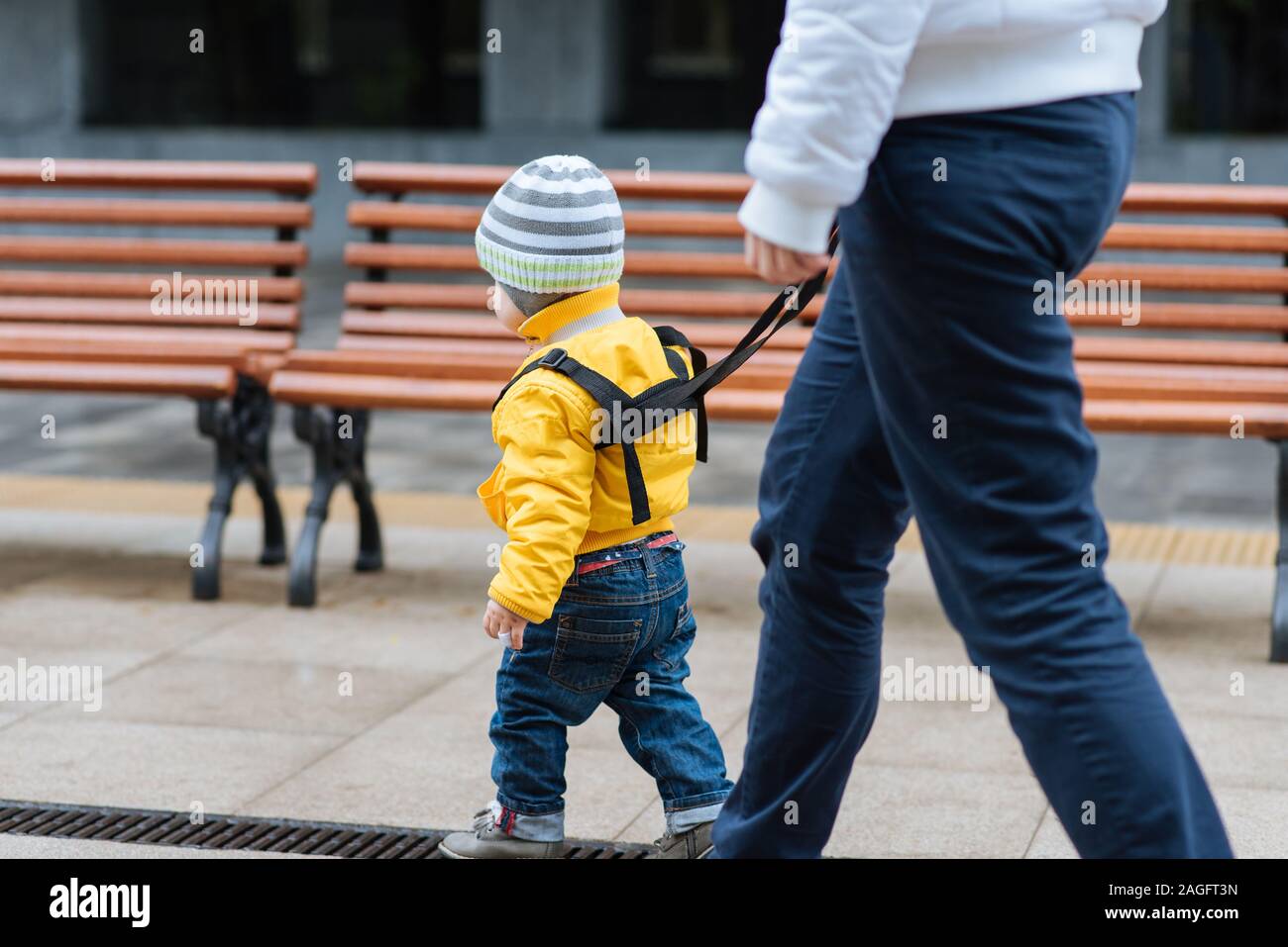 Mothers teach to walk on the road Stock Photo - Alamy
