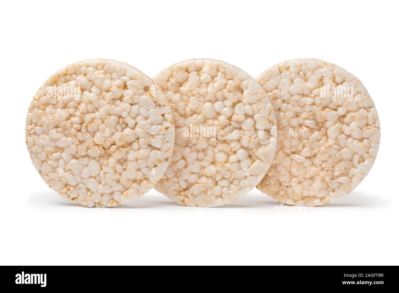 Whole round rice waffles in a row isolated on white background Stock ...