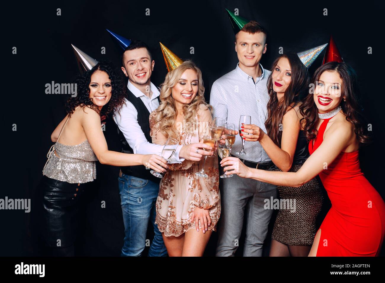 Friends birthday party. Six people having fun and drinking champagne on ...