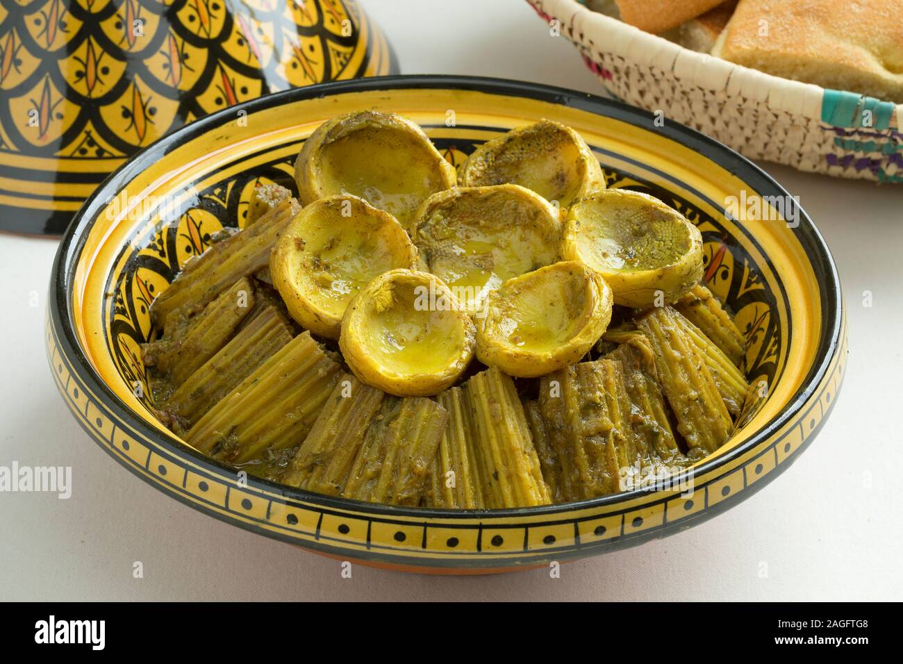 Traditional Moroccan tajine with Cardoon and artichoke hearts and bread ...