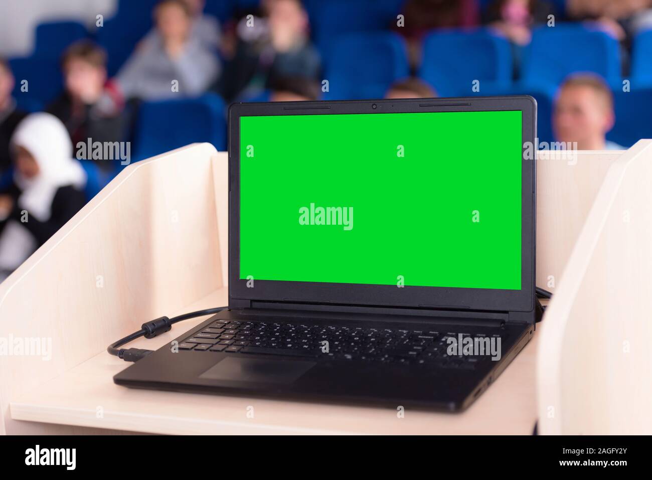 Laptop for presentation during business conference with green ...