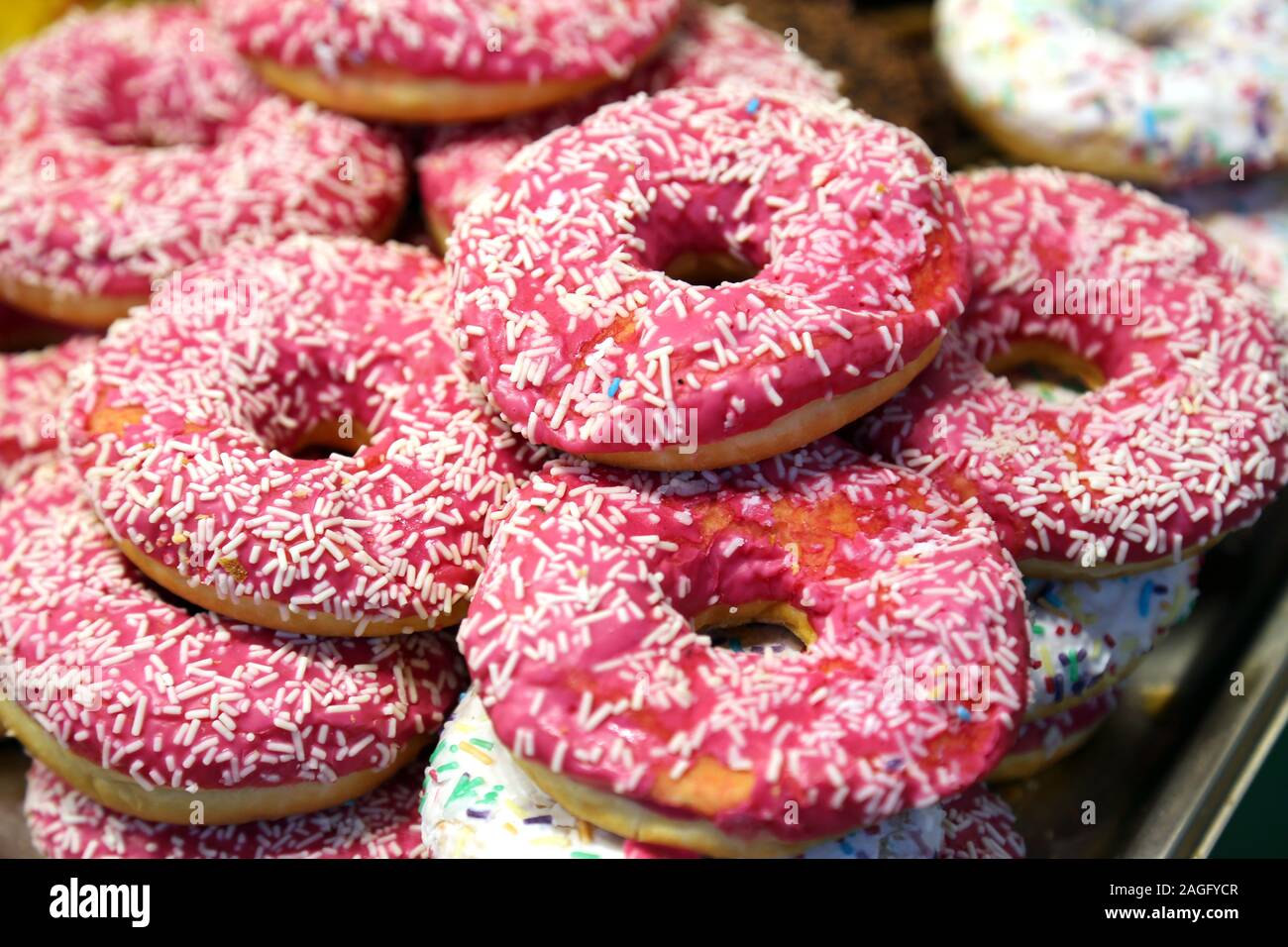 Display of traditional doughnuts on sale at christmas market stall ...