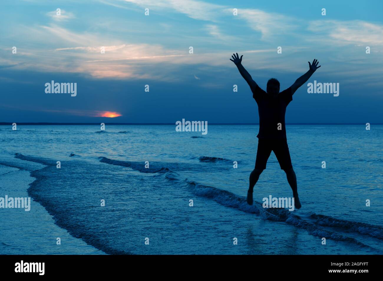 Silhouette of Man Raising His Hands or Open arms when sun rising up ...