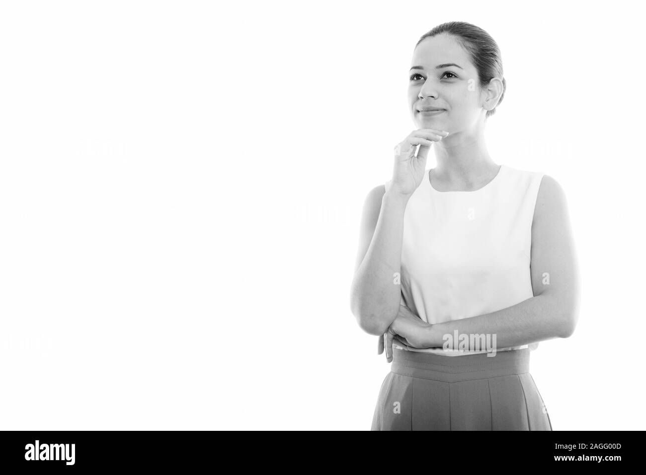 Studio shot of young beautiful woman thinking while looking up Stock ...