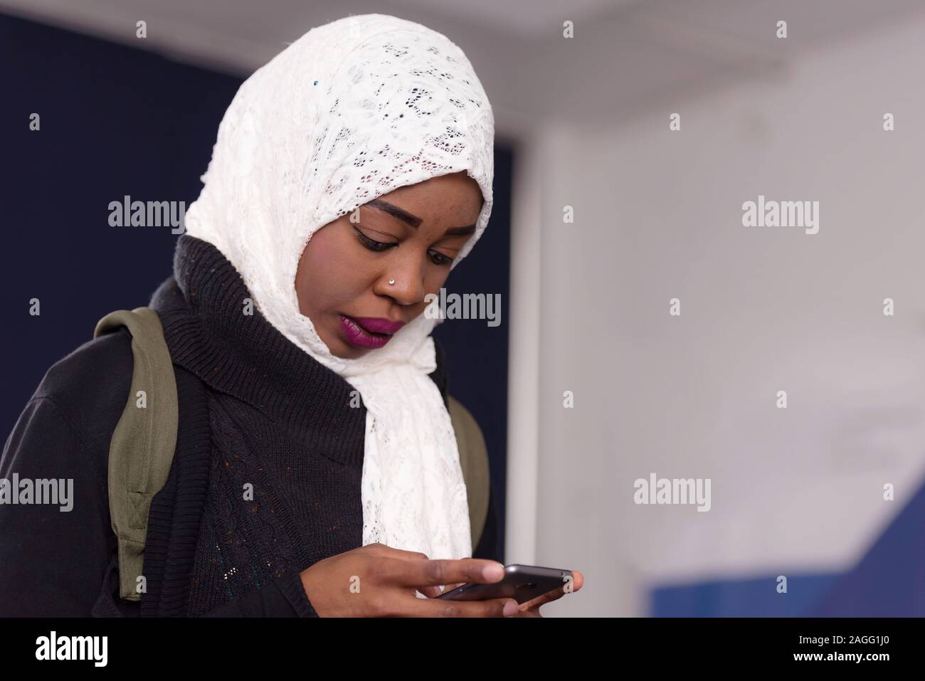 African american muslim business woman listening and watching ...