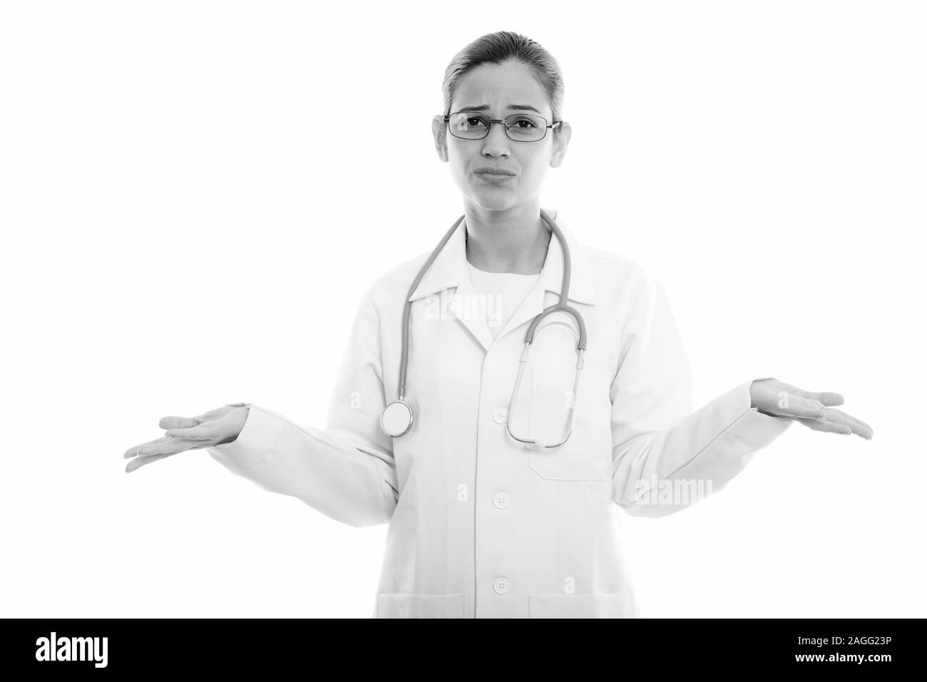 Studio shot of young beautiful woman doctor looking confused Stock ...