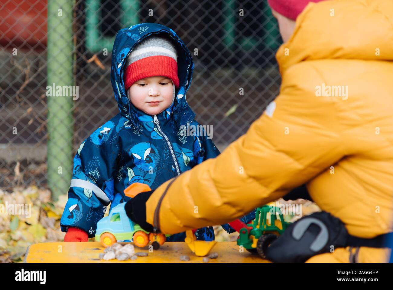 Mom and child play in the playground Stock Photo - Alamy