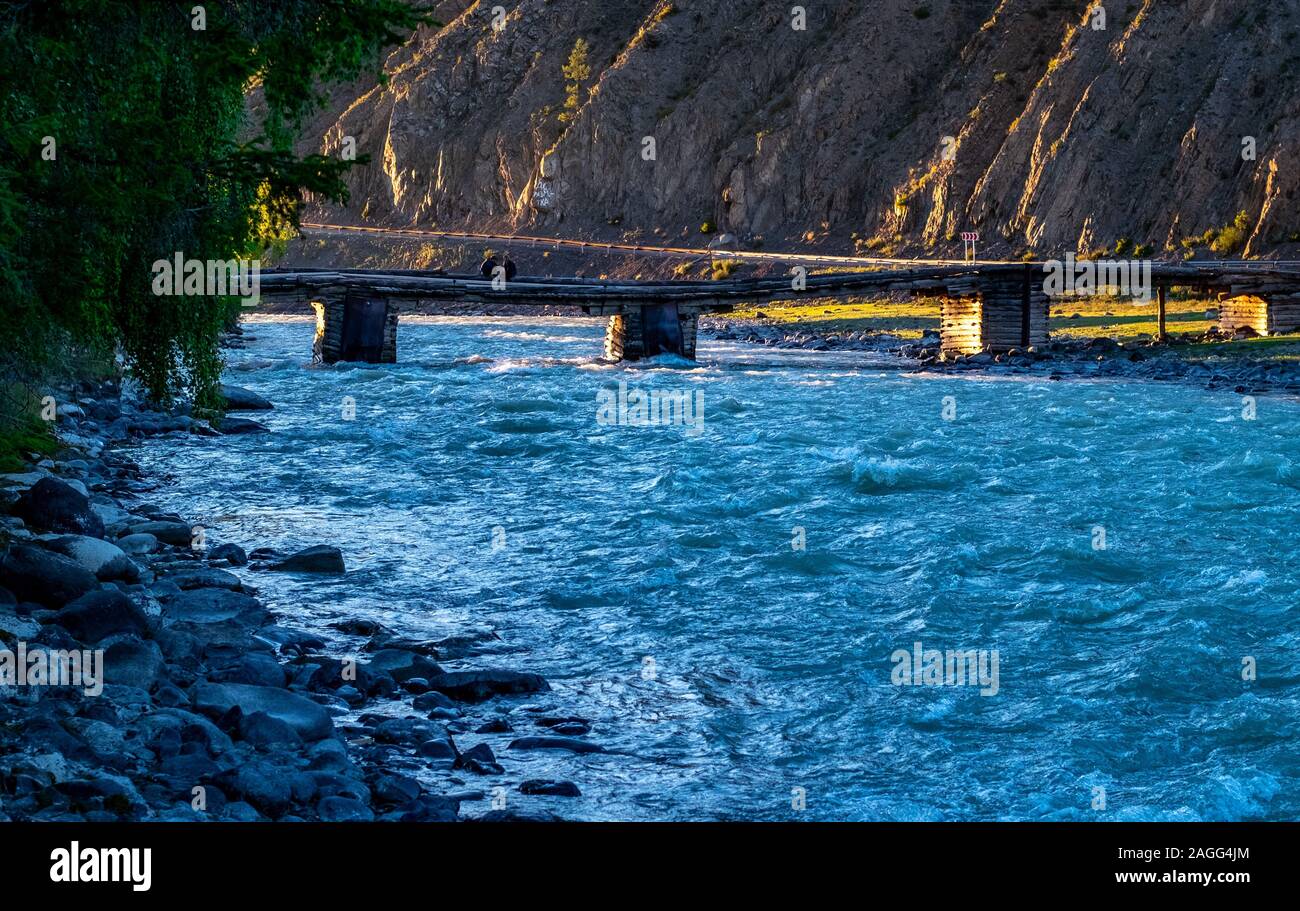 Wooden bridge over the Chuya river in the Altai Republic Stock Photo ...