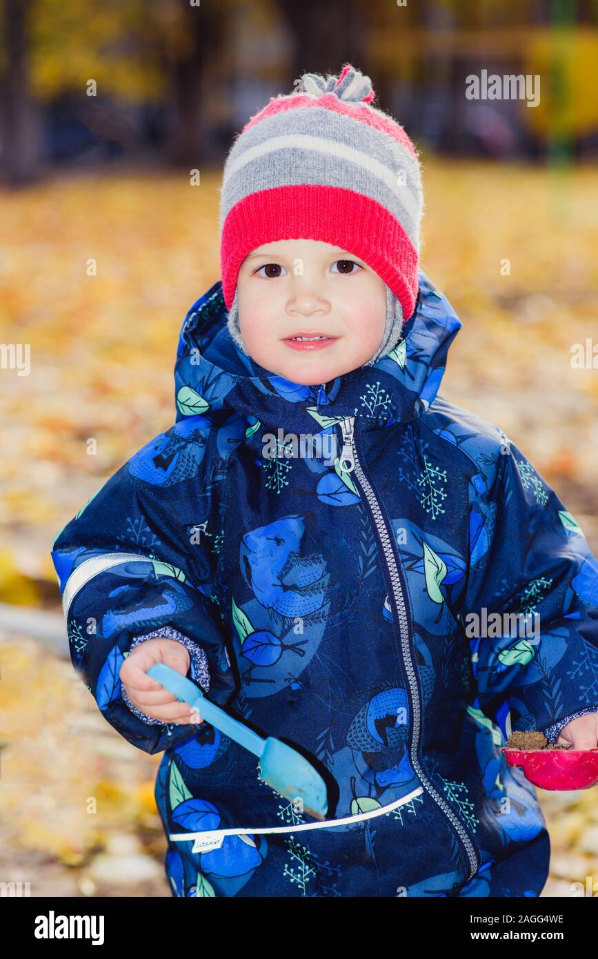 beautiful child playing in the playground during the day Stock Photo ...