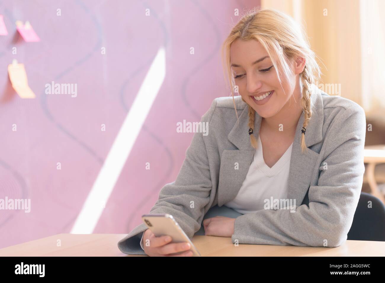 Happy young female talented designer looking at innovative project ...