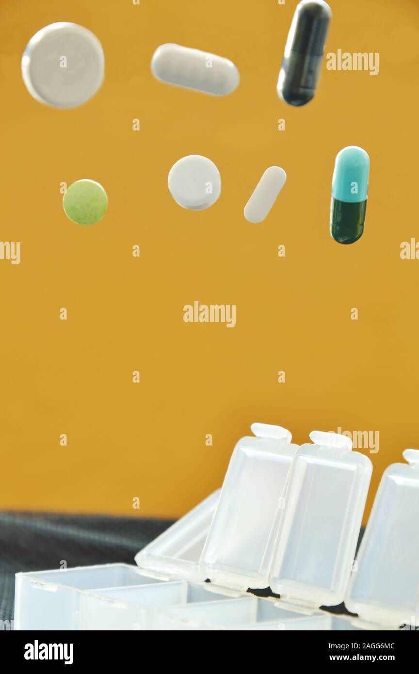 medicine and capsule dropping to plastic cartridges Stock Photo - Alamy