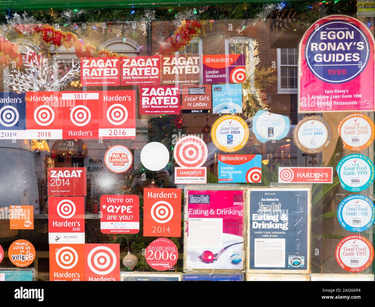 Restaurant guide award stickers in a chinese restaurant window Stock ...