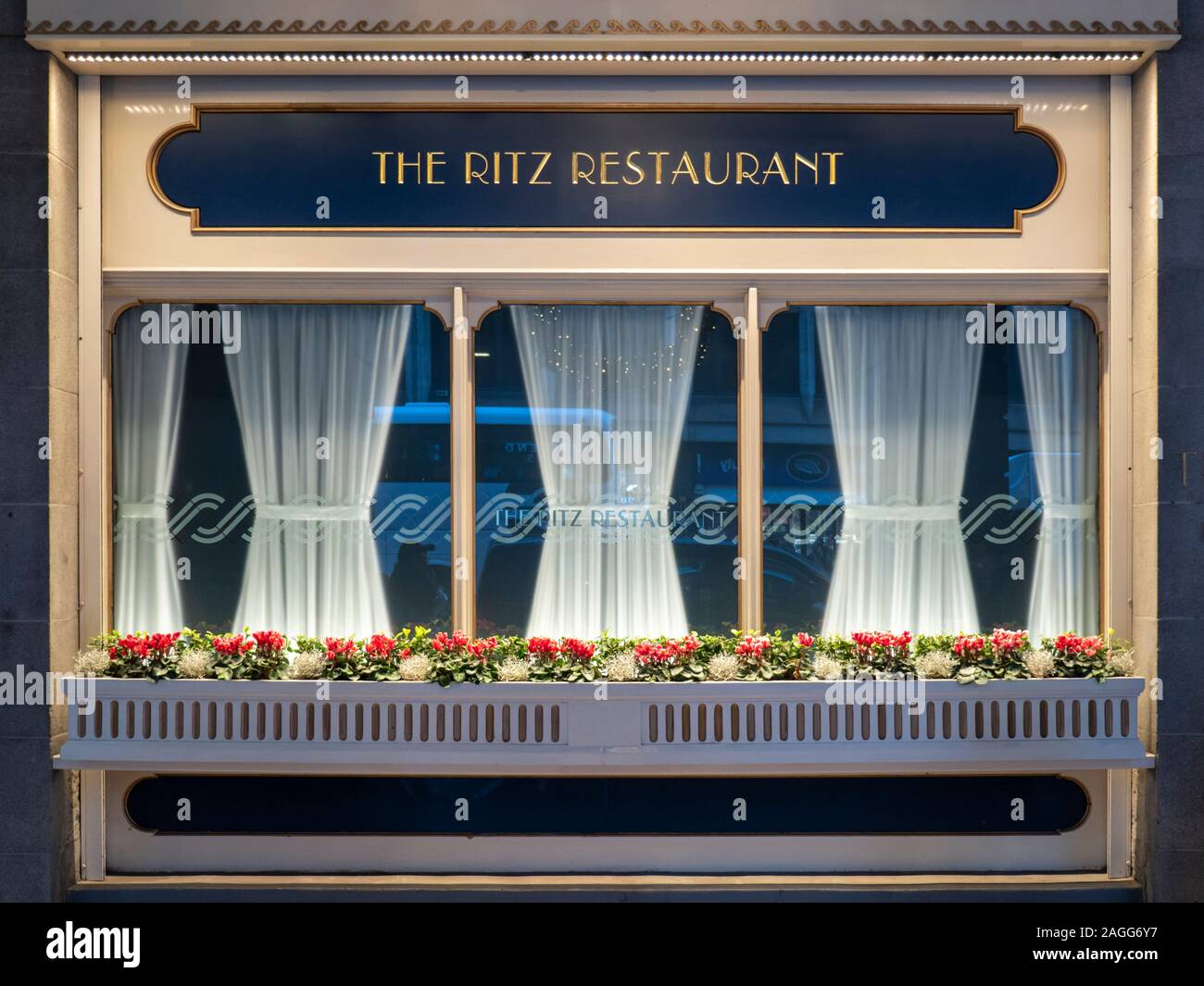 People walking past the window of the Ritz restaurant London UK, with ...