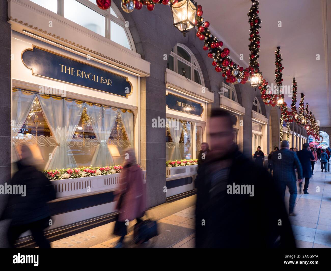 People walk past the Ritz hotel London UK, with slow shutter speed and ...