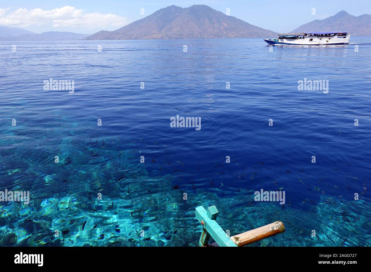 Indonesia Alor Island - reef edge and local ferry Stock Photo - Alamy