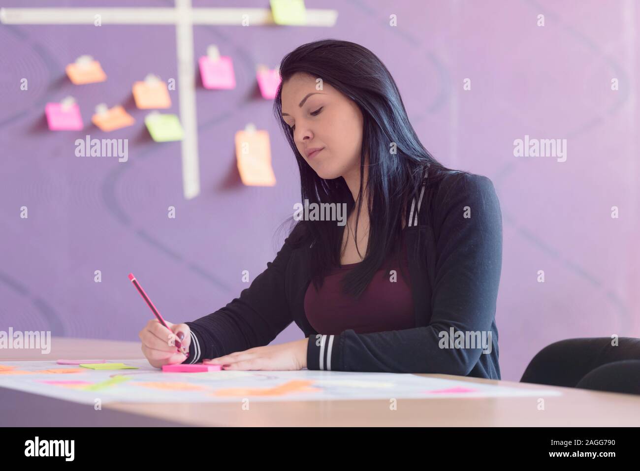 Happy young female talented designer looking at innovative project suggesting creative solution ...