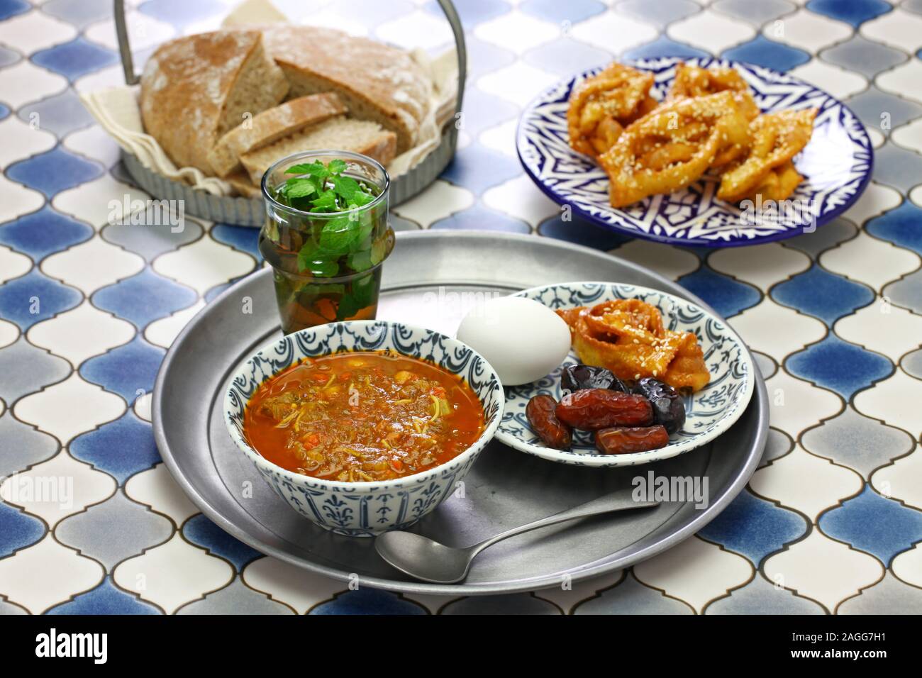 moroccan ramadan iftar meal, harira soup, chebakia, dates, mint tea and ...