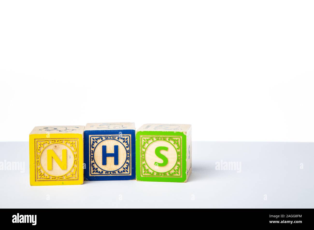 Childrens Wooden Alphabet Blocks Spelling the Word NHS Stock Photo - Alamy