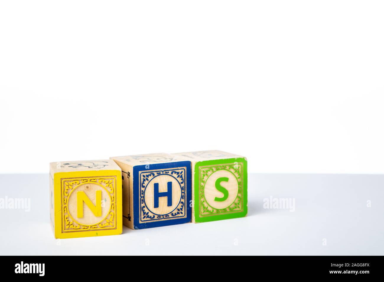 Childrens Wooden Alphabet Blocks Spelling the Word NHS Stock Photo - Alamy