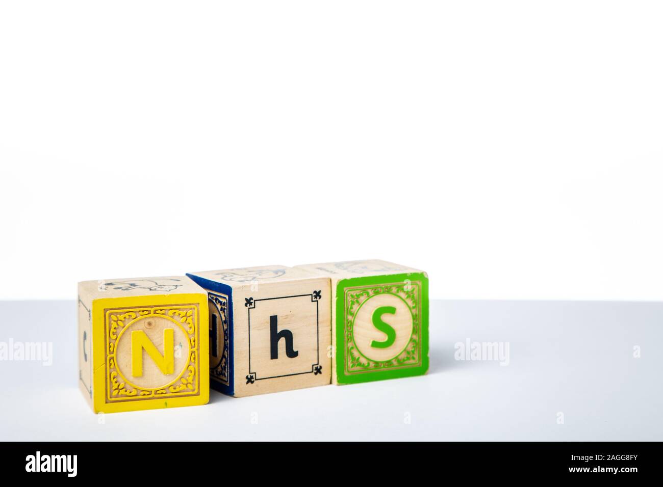 Childrens Wooden Alphabet Blocks Spelling the Word NHS Stock Photo - Alamy