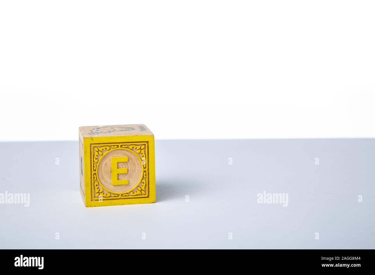 Childrens Wooden Alphabet Block Showing the Letter E Stock Photo - Alamy