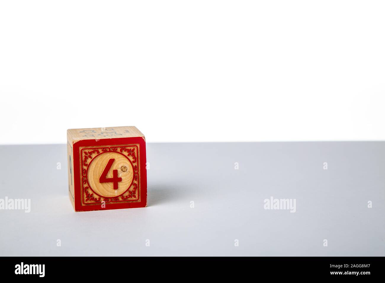 Childrens Wooden Alphabet Block Showing the Number 4 Stock Photo - Alamy