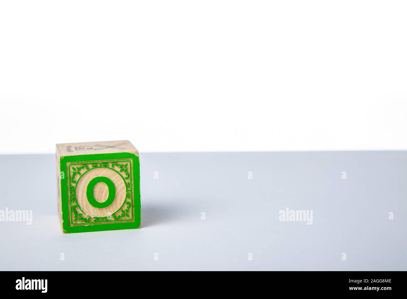 Childrens Wooden Alphabet Block Showing the Letter O Stock Photo - Alamy