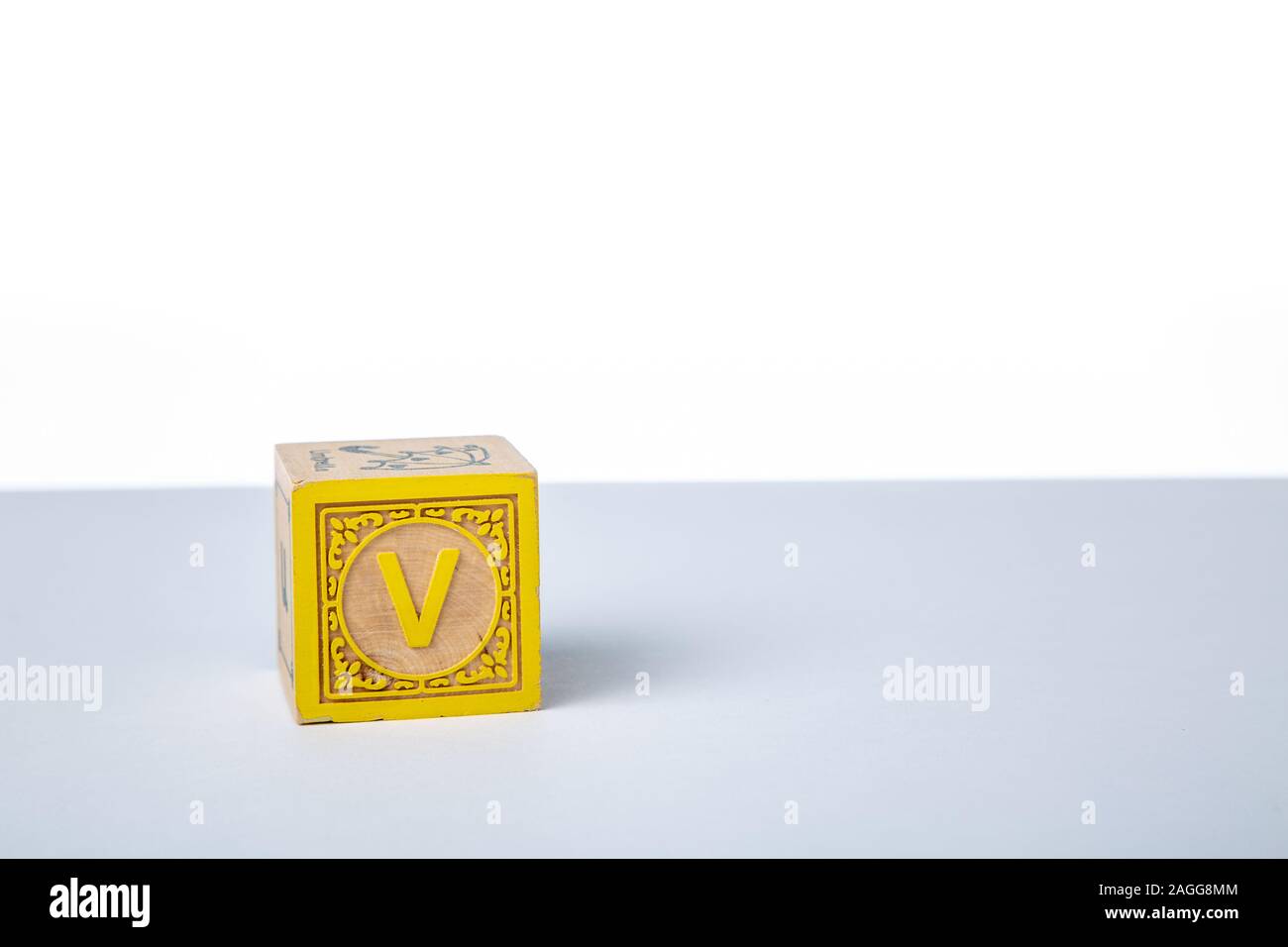 Childrens Wooden Alphabet Block Showing the Letter V Stock Photo - Alamy