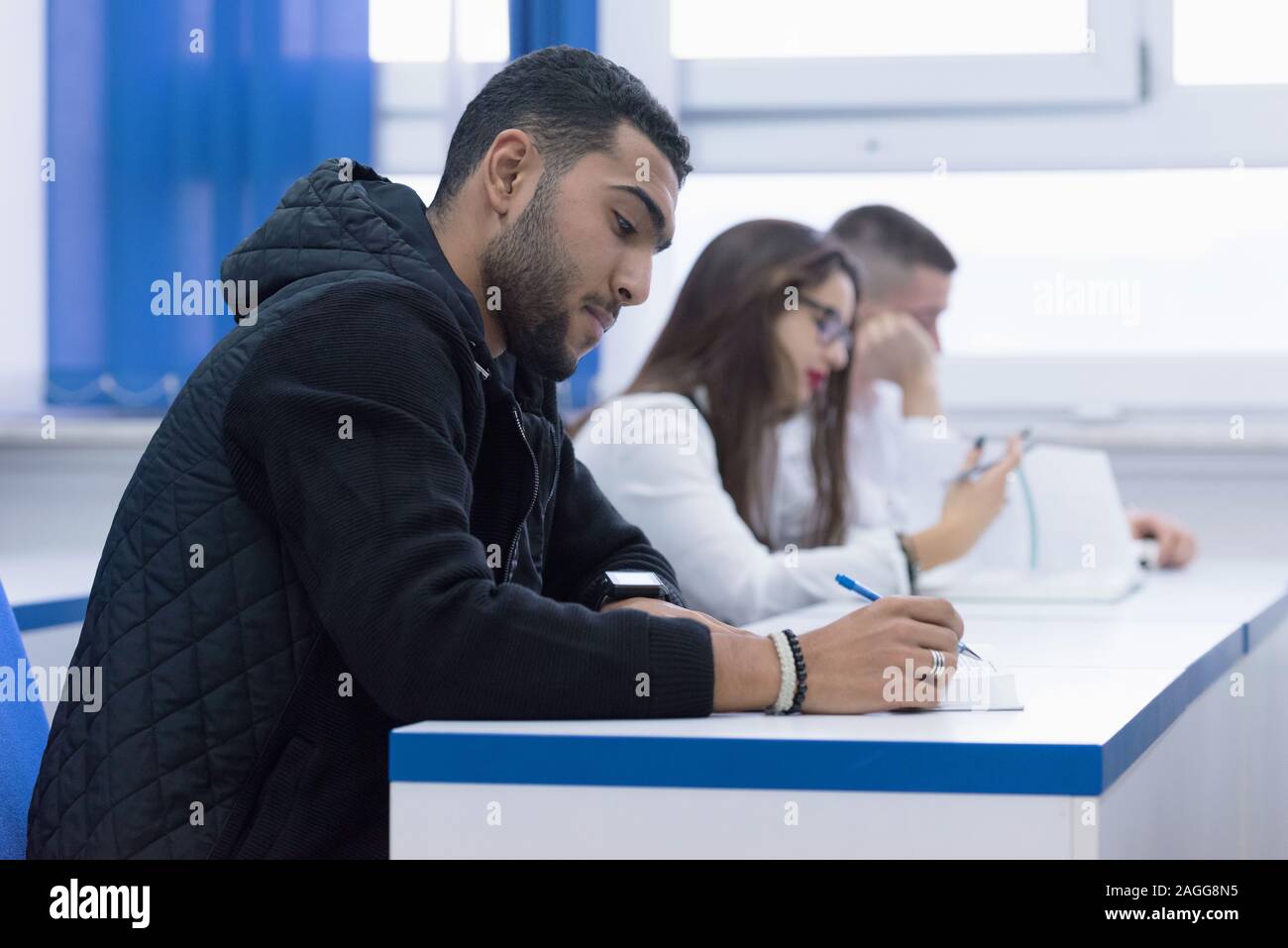 University Students during the class. Resolving problems together. Team ...