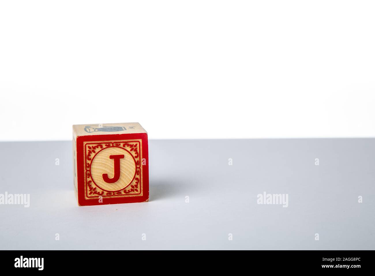 Childrens Wooden Alphabet Block Showing the Letter J Stock Photo - Alamy