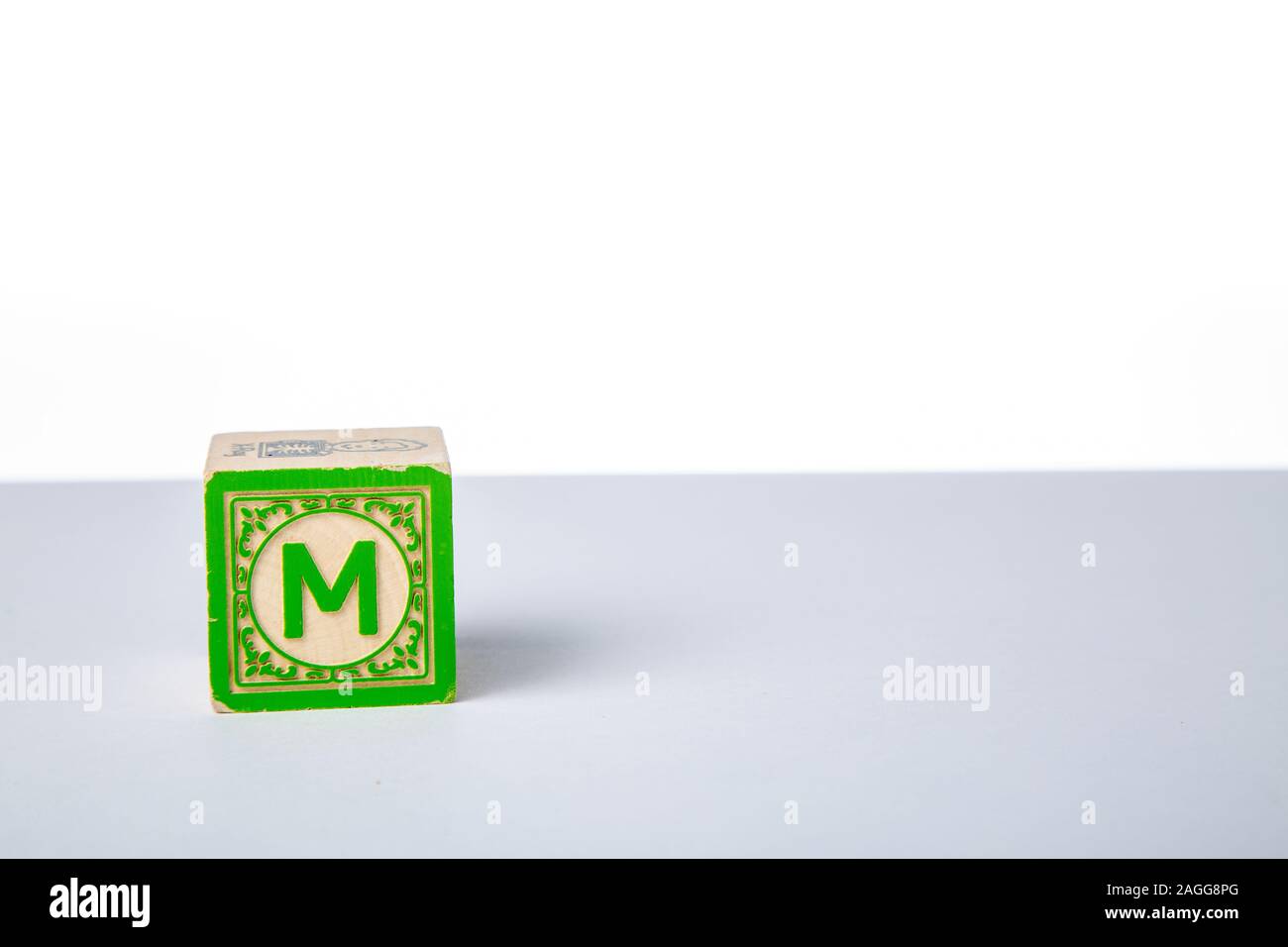 Childrens Wooden Alphabet Block Showing the Letter M Stock Photo - Alamy