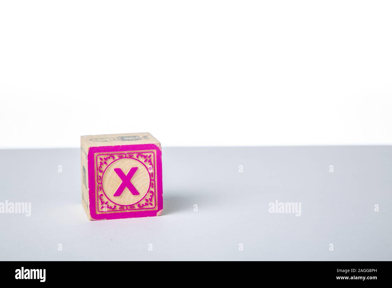 Childrens Wooden Alphabet Block Showing the Letter X Stock Photo - Alamy