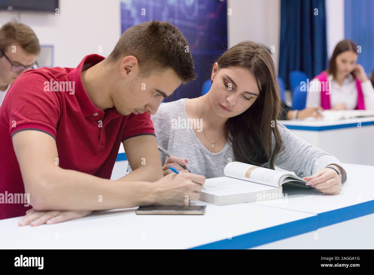 University Students during the class. Resolving problems together. Team ...